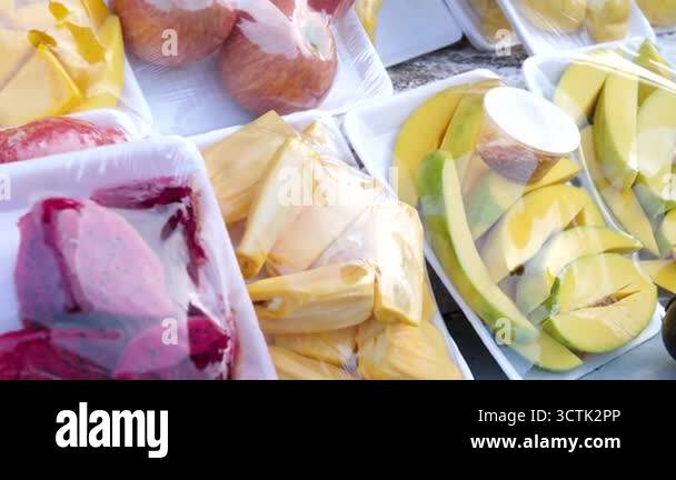 Premium red grapes neatly packed in plastic-wrapped foam trays for sale ...