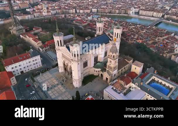 Aerial panorama of Lyon with Fourviere Basilica towers dome plaza and ...