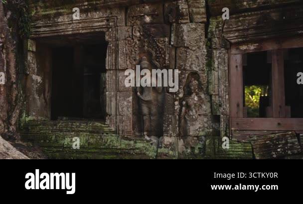 Cinematic video shows detailed carvings of Ta Prohm temple followed by ...