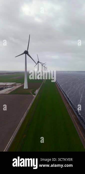Impressive aerial perspective of modern wind turbines generating ...