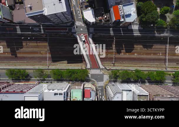 Aerial view of Tokyo showing a railway with multiple tracks, a red ...