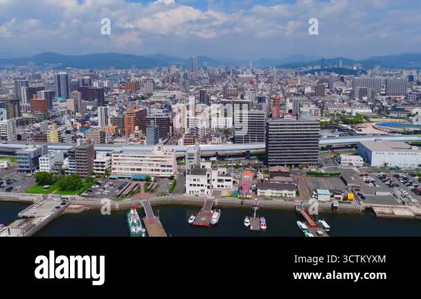 Aerial view of Hiroshima city showing downtown buildings, a moving ...