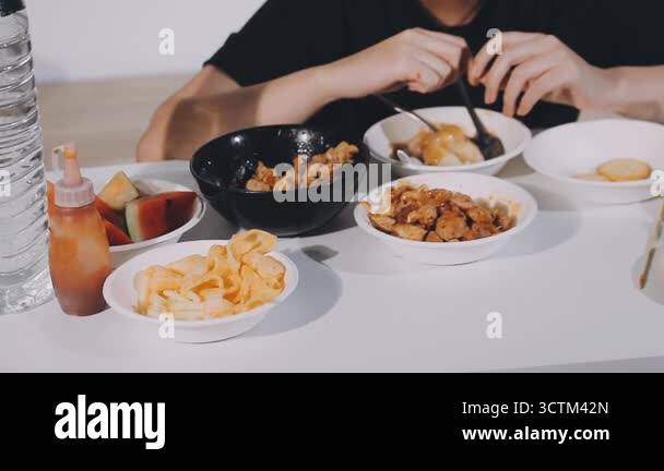 woman eating fried chicken, asian fast food Stock Video Footage - Alamy