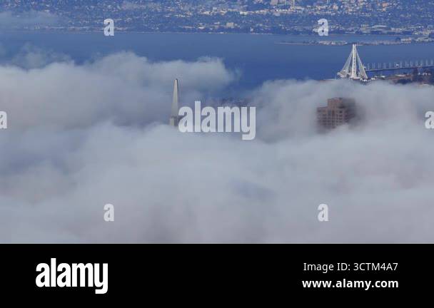 Aerial view of San Francisco with clouds moving over the cityscape ...