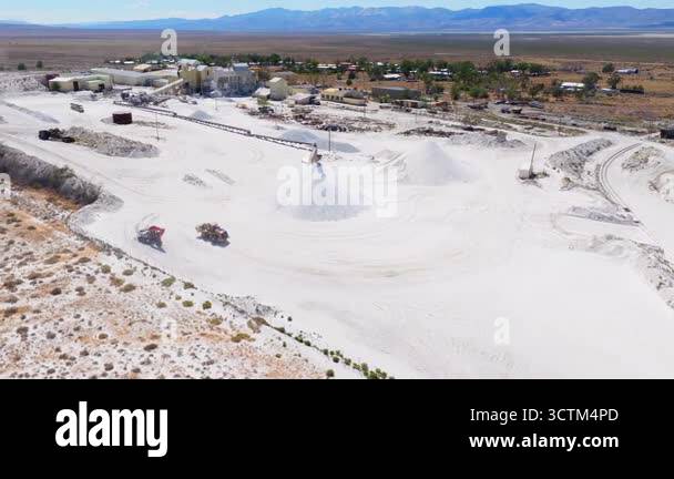 Salt mining site in Nevada showing white salt mounds, conveyor belts ...