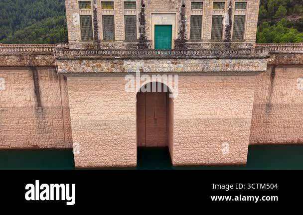 Close-up aerial video of the historic Benageber Dam in Valencia, Spain ...