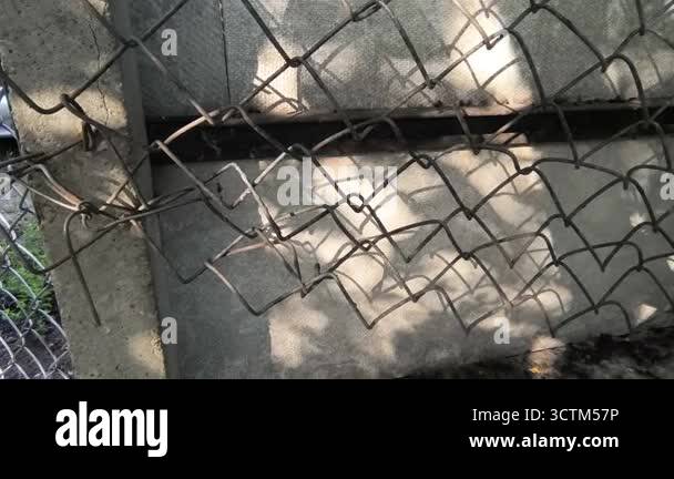 wire fence. chain link mesh. rusty iron fence. old rusty cage. symbol ...