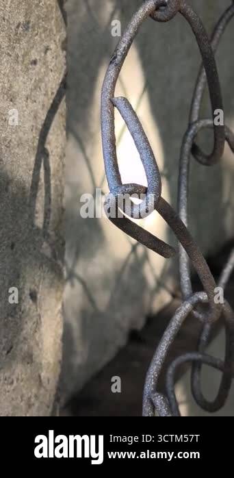 wire fence. chain link mesh. rusty iron fence. old rusty cage. symbol ...