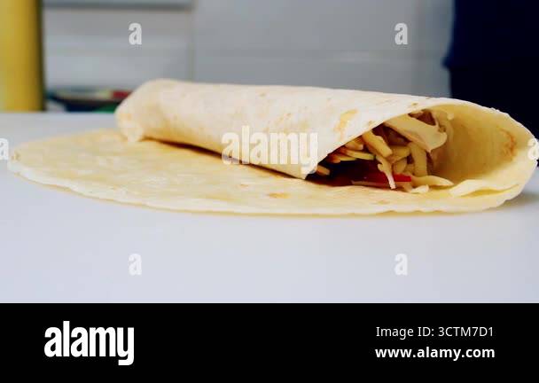 Chef finishes cooking tasty pita. Hands of a cook spreading mayonnaise ...