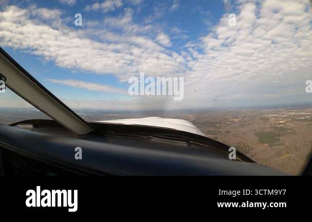 The aircraft banks gently, descending toward the runway, flaps deployed ...
