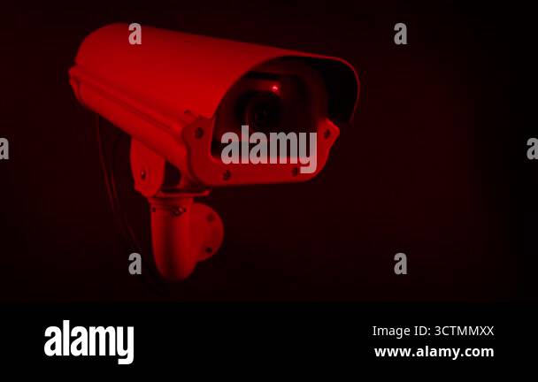 CCTV Camera In Red Security Light In Facility Stock Video Footage - Alamy