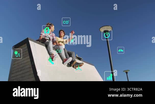 Woman and man pointing and nodding at energy icons appearing around ...