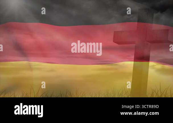 Storm clouds parting causing beam lighting field and red-gold flag ...