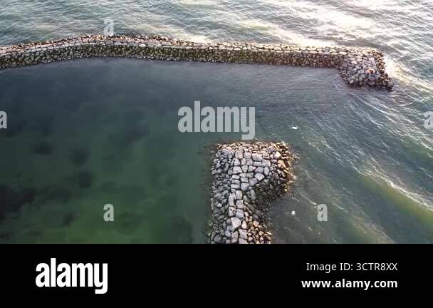 Aerial view of sturdy piers and wave breakers at Lausanne, protecting ...
