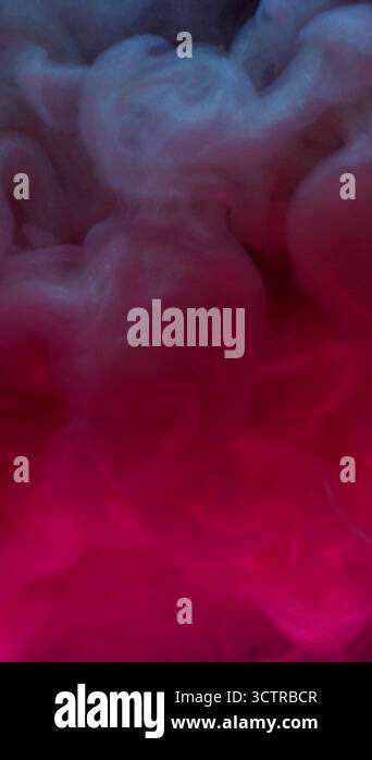 Vertical video. Paint explosion. Mist swirl. Pink gray pigment shape ...