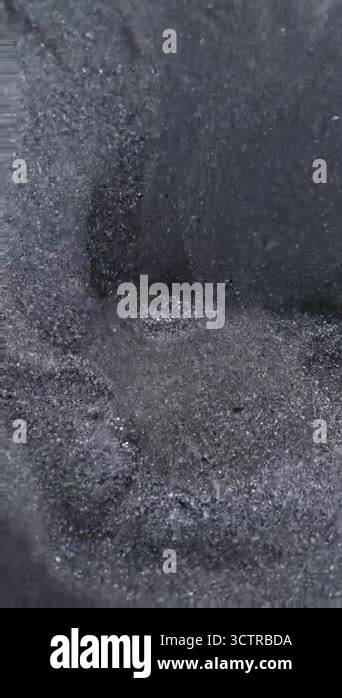 Vertical video. Shiny flow. Ink background. Defocused silver color ...