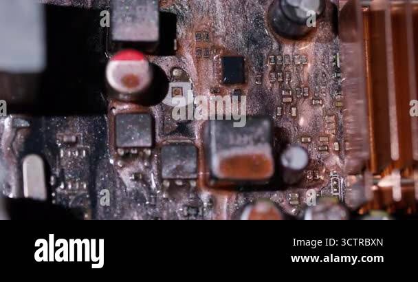 Leaking paint. Digital microcircuit. Defocused orange silver red ...