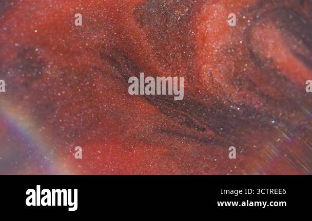 Shimmering mix. Blur paint water. Orange black sparkling liquid stream ...