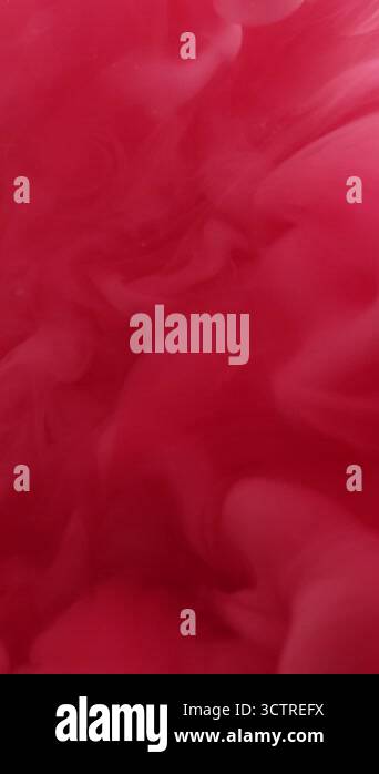 Vertical video. Steam floating. Fog texture. Defocused red crimson ...