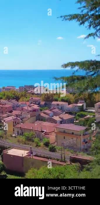 Scenic Coastal View From a Hilltop Overlooking a Tranquil Sea and ...