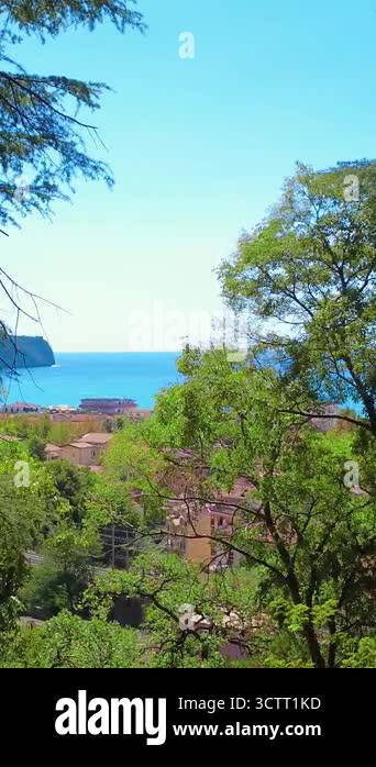 Scenic Coastal View From a Hilltop Overlooking a Tranquil Sea and ...