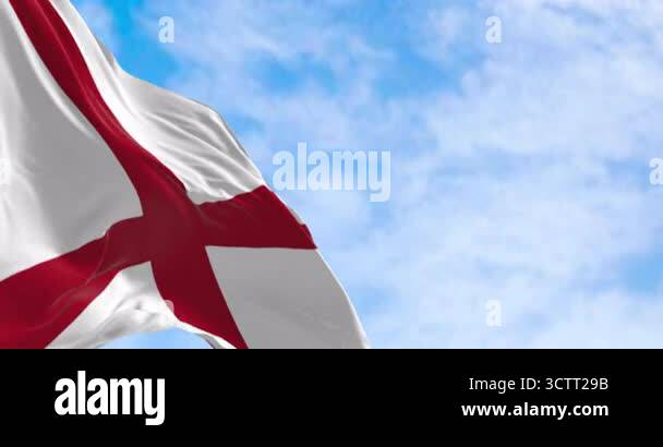 Close-up of Alabama state flag waving on a sunny day. The flag of ...