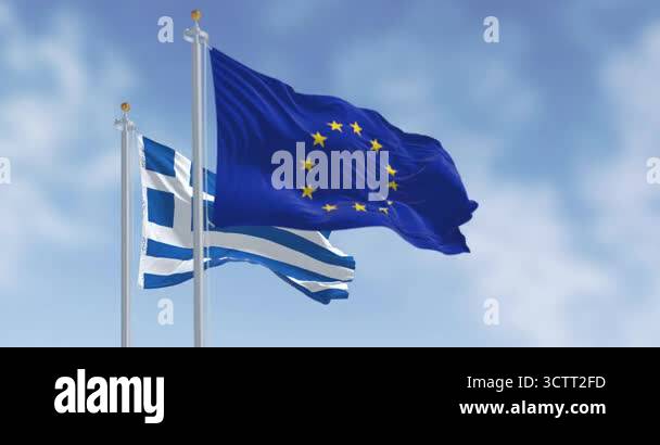 Flags of Greece and the European Union wave side by side against a ...