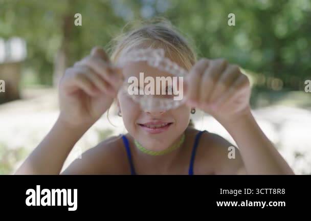 Happy girl looking through clear Stock Videos & Footage - HD and 4K ...