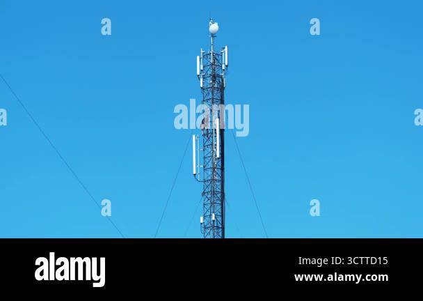 Maintenance staff at work. Cell tower on blue background. High-altitude ...