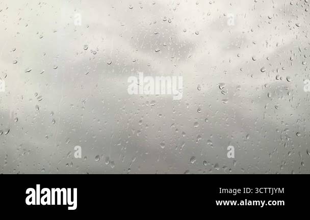 Raindrops on the window, rain in the city, cloudy weather, wet window ...