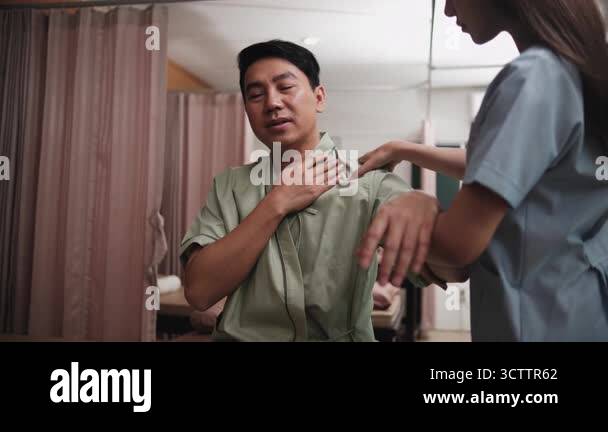 Male Asian patient is hand stretching, treated for health recovery for ...