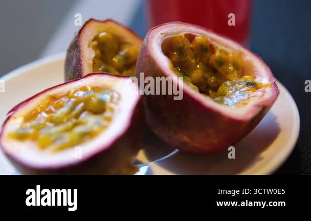 Ripe passion fruits with passion fruit seeds and passionfruit leaves ...