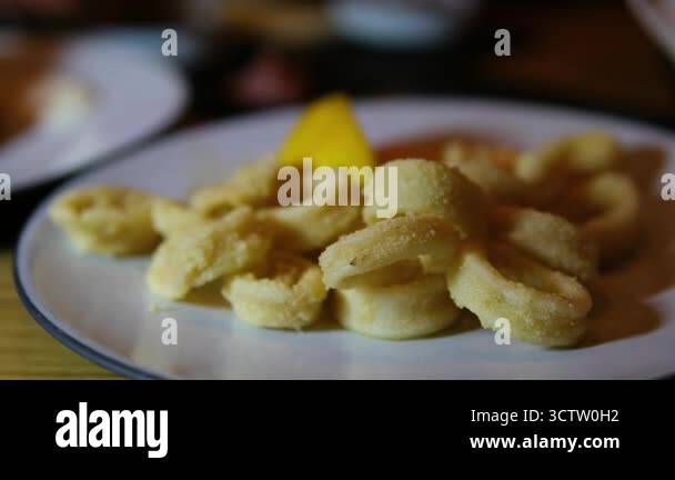 Delicious and tasty fried calamari squid rings on plate, calamari ...