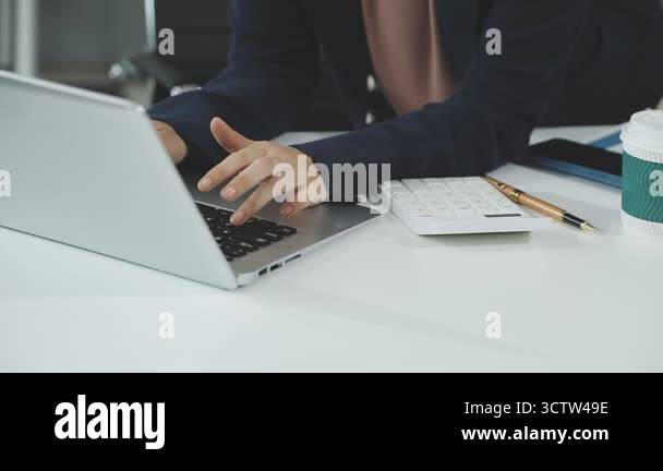 businesswoman using laptop and typing at work in modern office Stock ...