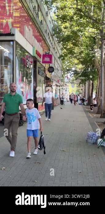 City Street Scene In Chisinau Moldova With People Walking Past city-street-scene-in-chisinau-moldova-with-people-walking-past