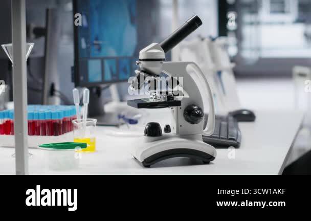 Microscope tool placed on desk in laboratory for scientific experiment ...