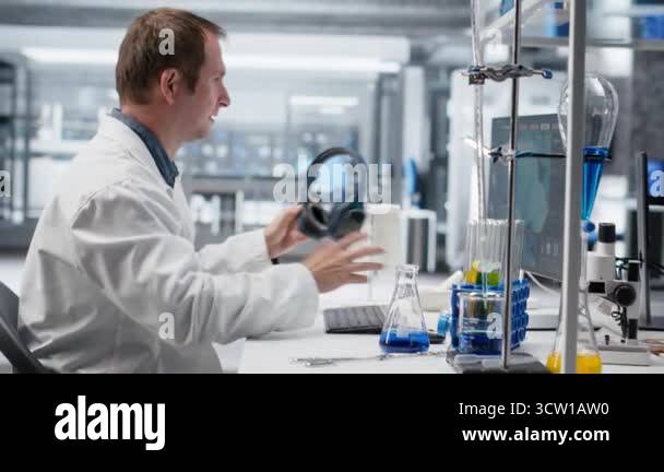 Unconventional scientist listens to music while conducting experiment ...