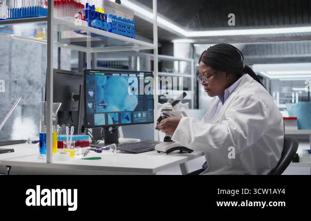 African american woman analyzing molecular samples in a bio lab, using ...