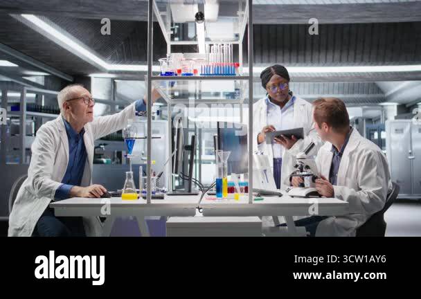 Team of experts investigate molecular samples at microscope with ...