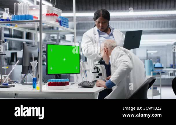Isolated mockup on monitor next to diverse team in chemistry lab ...