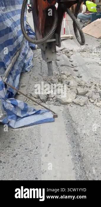 Concrete road demolition and jackhammer pneumatic breaker roadwork ...