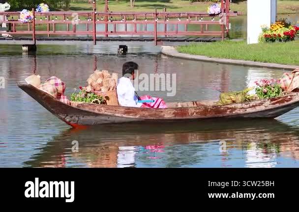 Person rowing a boat with goods in Bangkok Stock Video Footage - Alamy
