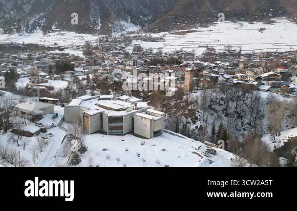 Mestia, Georgia - 16th march, 2025: aerial fly over view of Mestia in ...