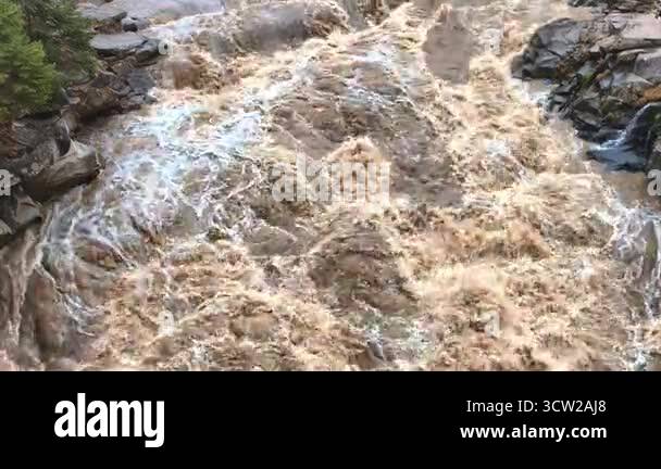 High-definition video of a powerful waterfall cascading over rocky ...