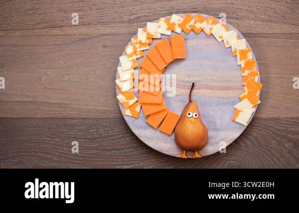 Thanksgiving turkey theme cheese board. Stop motion placement. Top down ...