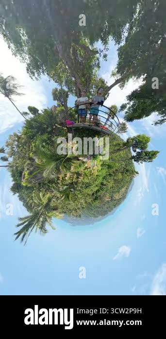 Vertical video. Two People Standing on an Elevated Circular Platform ...