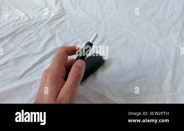 Demonstration of a smoking cessation moment. Hand removing a used ...