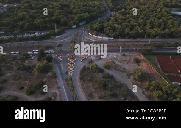 Aerial drone view of urban roundabout with cars and streets. Modern ...