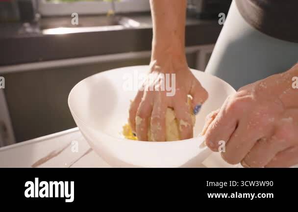 Close Up Hands Kneading Sticky Dough in White Bowl with Sunlight ...