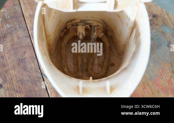 A detailed close-up view of an electric kettle's heating spiral ...